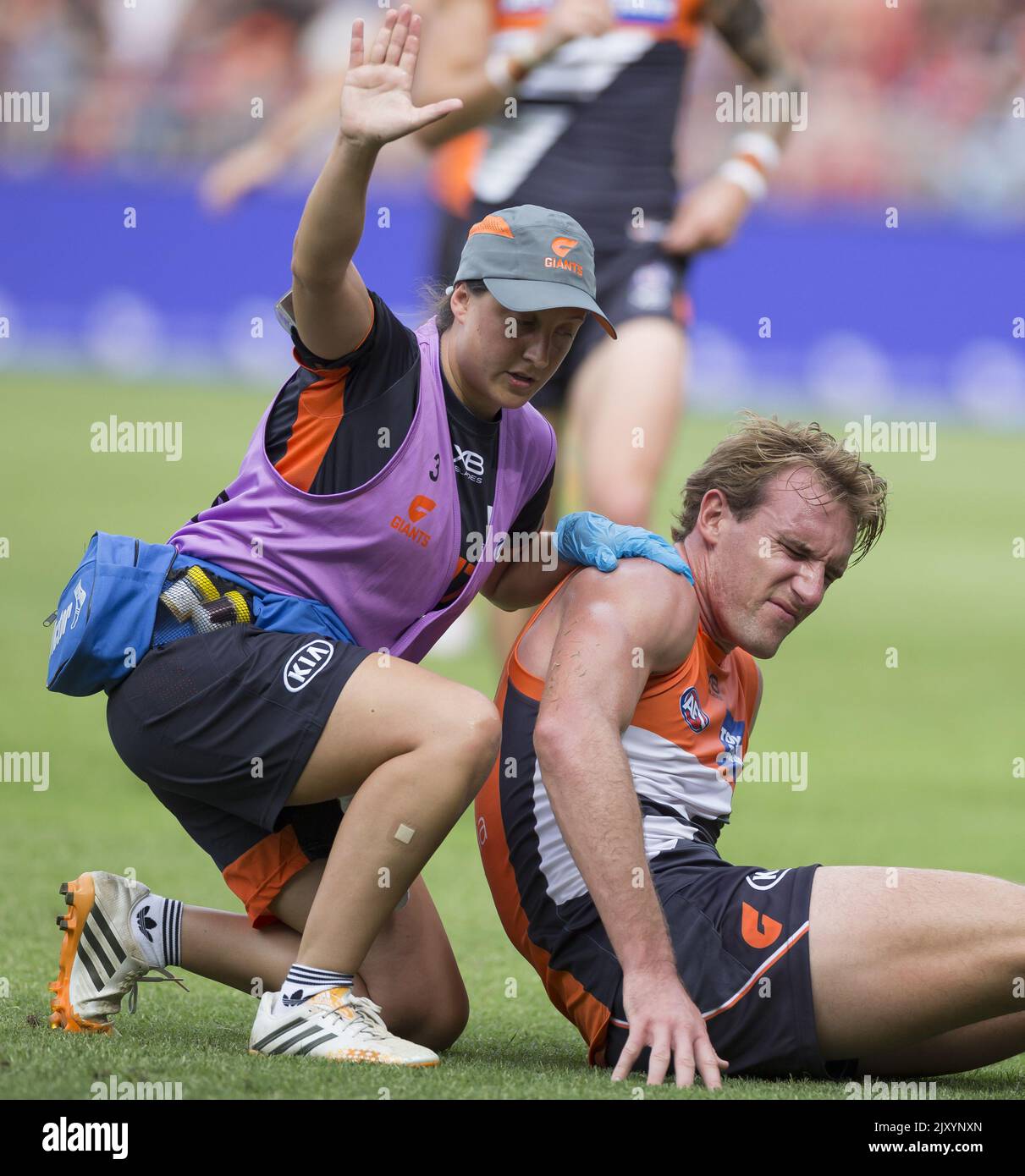 Lachlan Keeffe of the Giants is injured and leaves the field during the ...