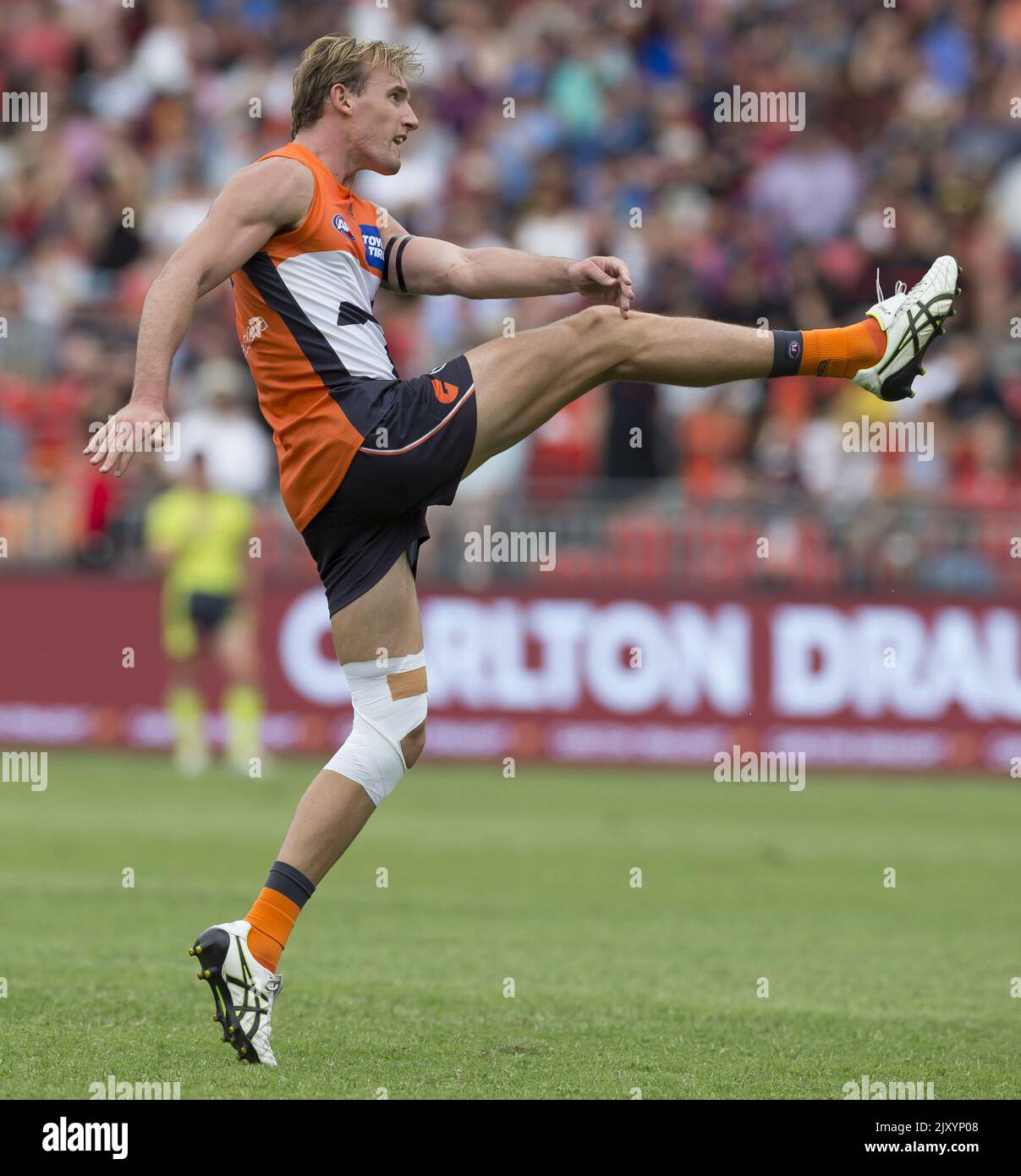Lachlan Keeffe of the Giants kicks a goal during the Round 1 AFL match ...