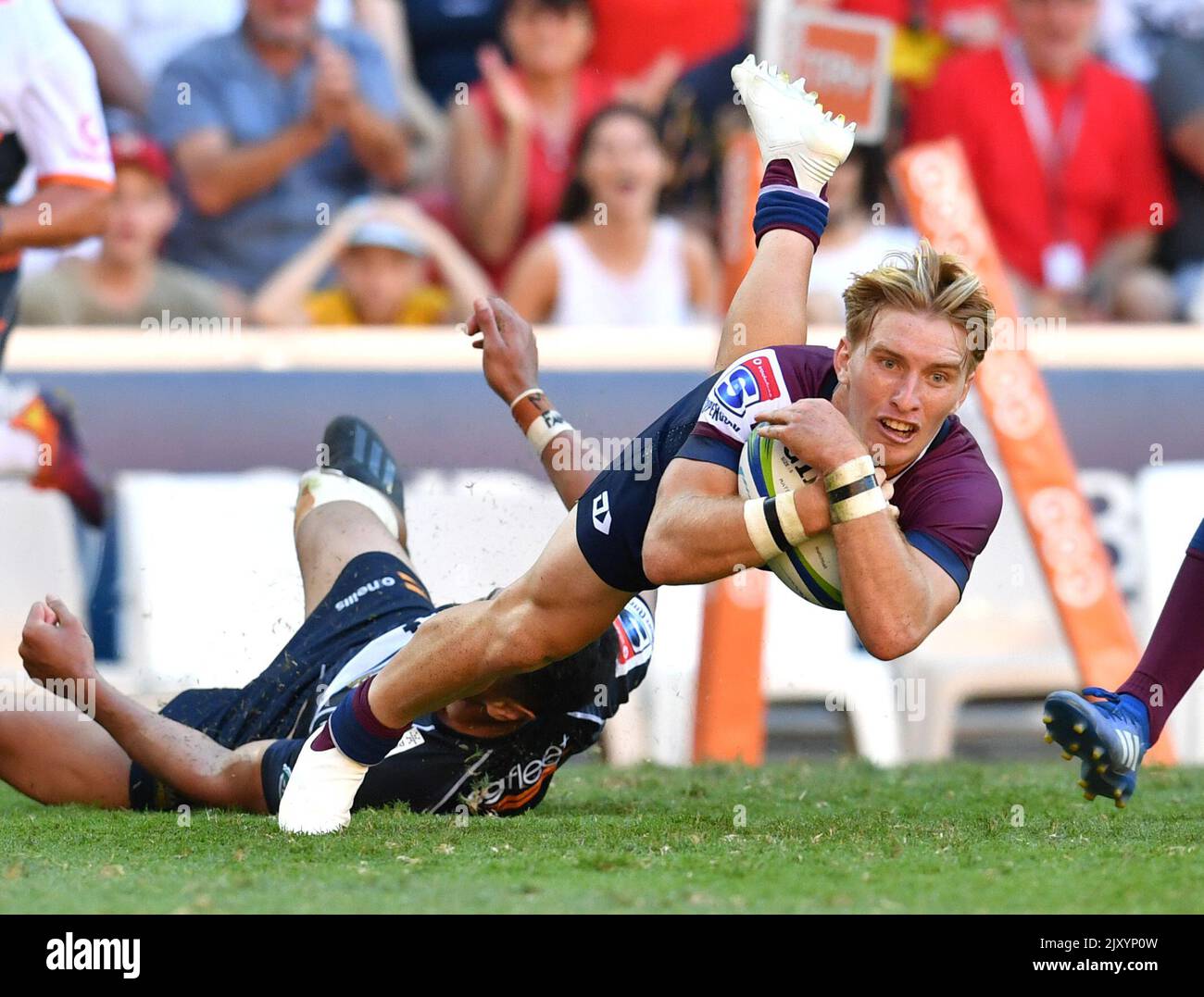 Tate McDermott of the Reds dives over to score a try during the Round 6 ...
