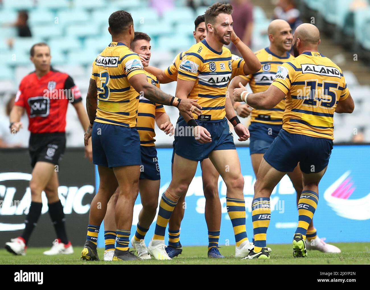 Clint Gutherson of the Eels celebrates with teammates after scoring a ...
