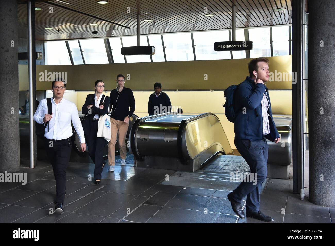 People are seen leaving Flagstaff train station in Melbourne, Thursday ...