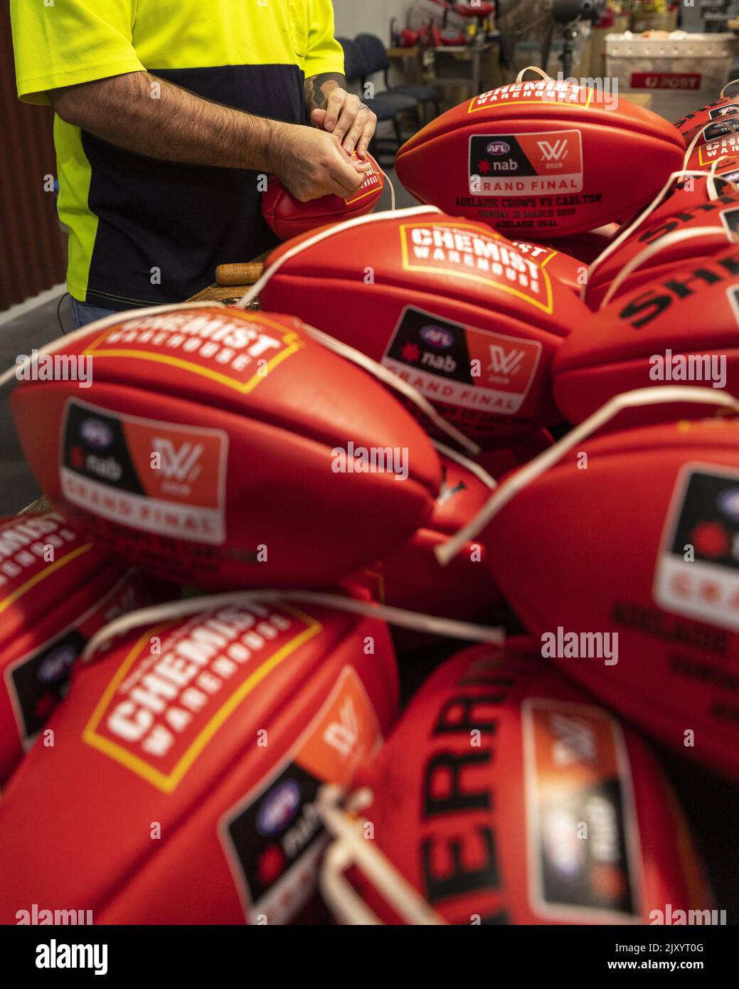 Staff work on the production of Sherrin footballs to be used in the ...