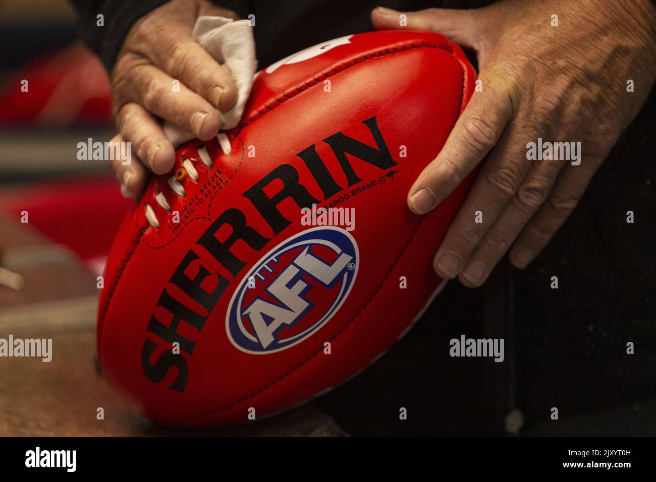 Staff work on the production of Sherrin footballs to be used in the ...