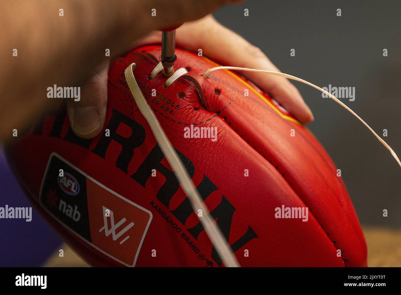 Staff work on the production of Sherrin footballs to be used in the ...