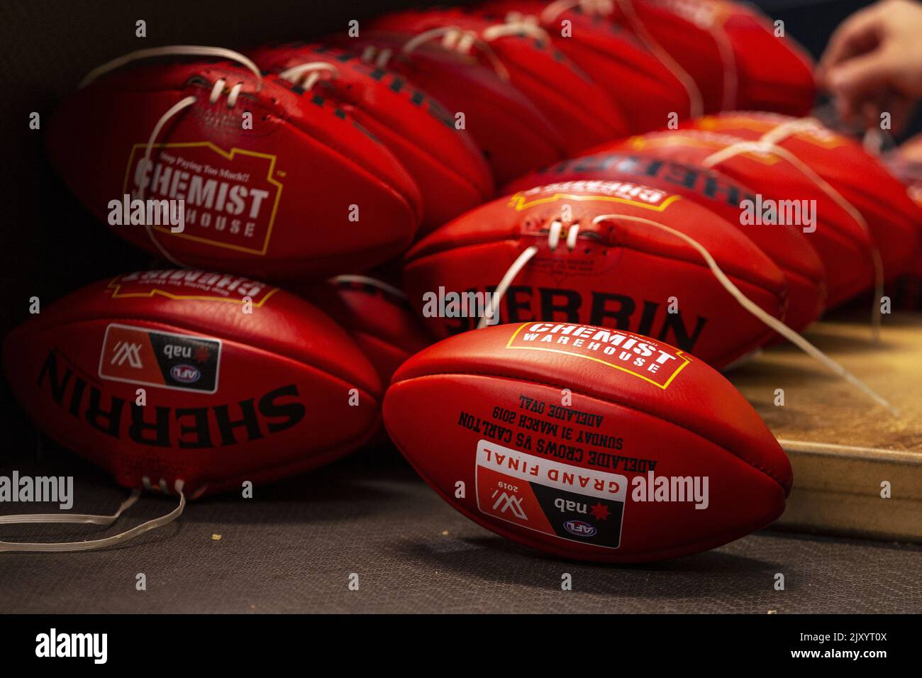 Staff work on the production of Sherrin footballs to be used in the ...