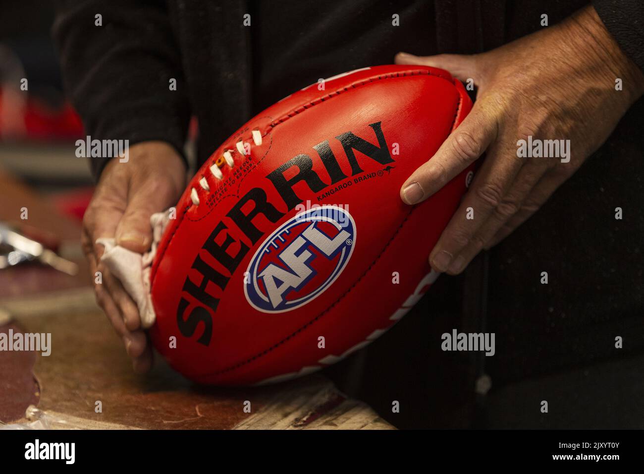 Staff work on the production of Sherrin footballs to be used in the ...