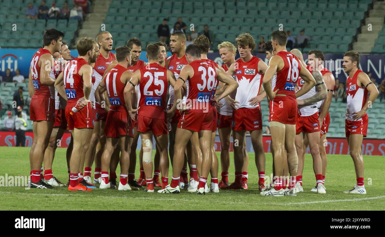 Swans players huddle in the middle after their loss during the Round 2 ...