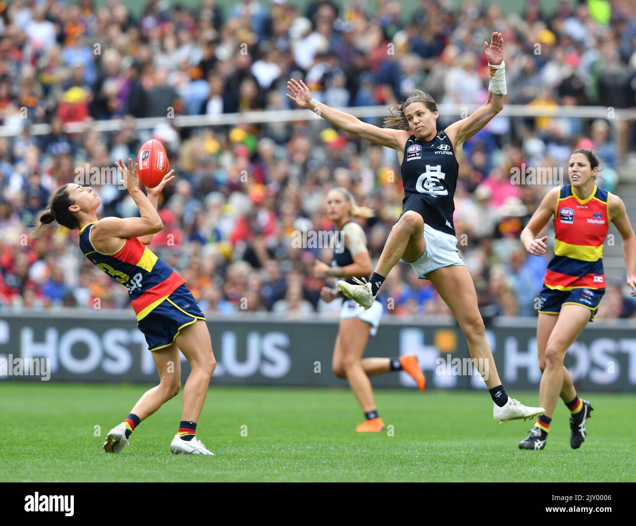 Angela Foley of the Adelaide Crows and Chloe Dalton of the Blues during ...