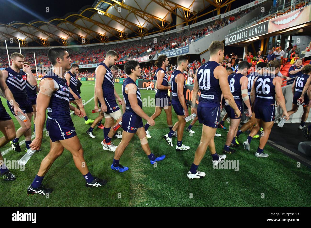 Dockers players are seen leaving the field after losing the AFL Round 2 ...