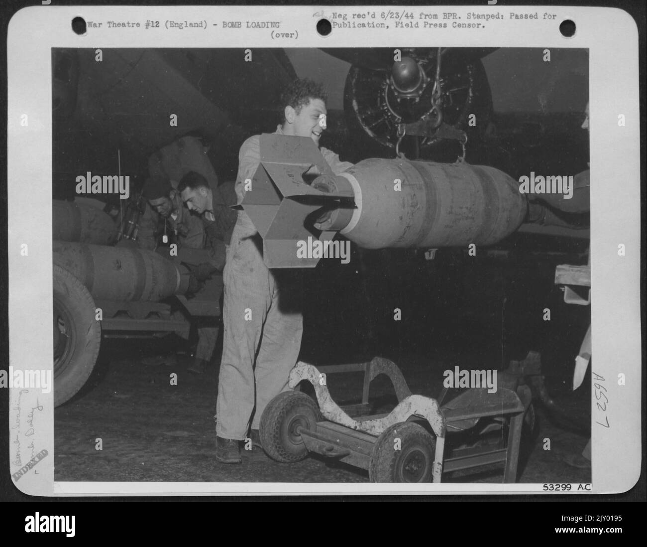 Shown is a jubilant armor crewman shoving a high explosive bomb away to ...