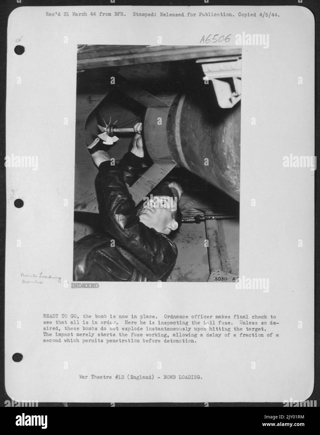 READY TO GO, the bomb is now in place. Ordnance officer makes final ...
