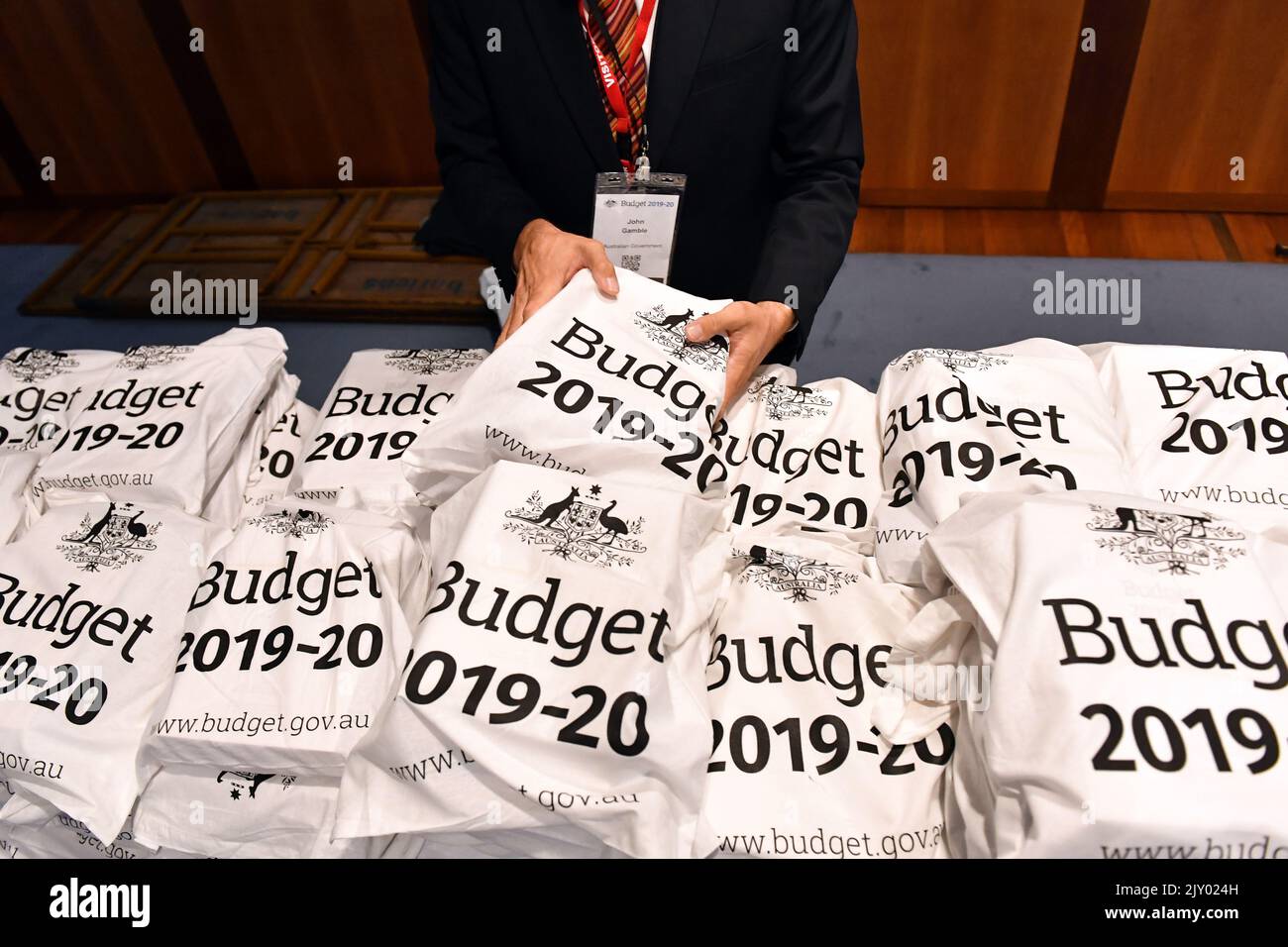 A Treasury official arranges the bags with the Budget papers during the ...