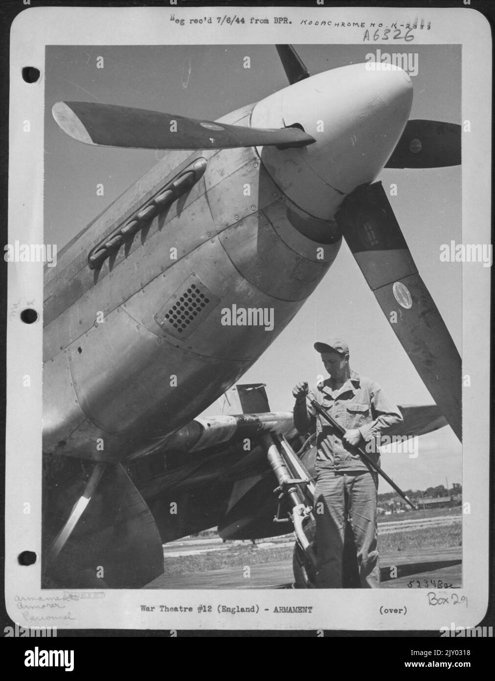 Cleaning the barrel of one of the four .50 cal guns arming the 8th AAF ...