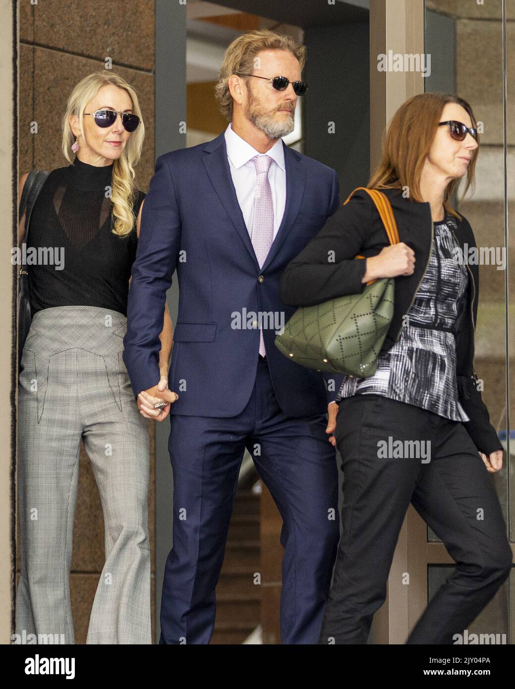 Craig McLachlan and partner Vanessa Scammell (left) leave the Melbourne ...