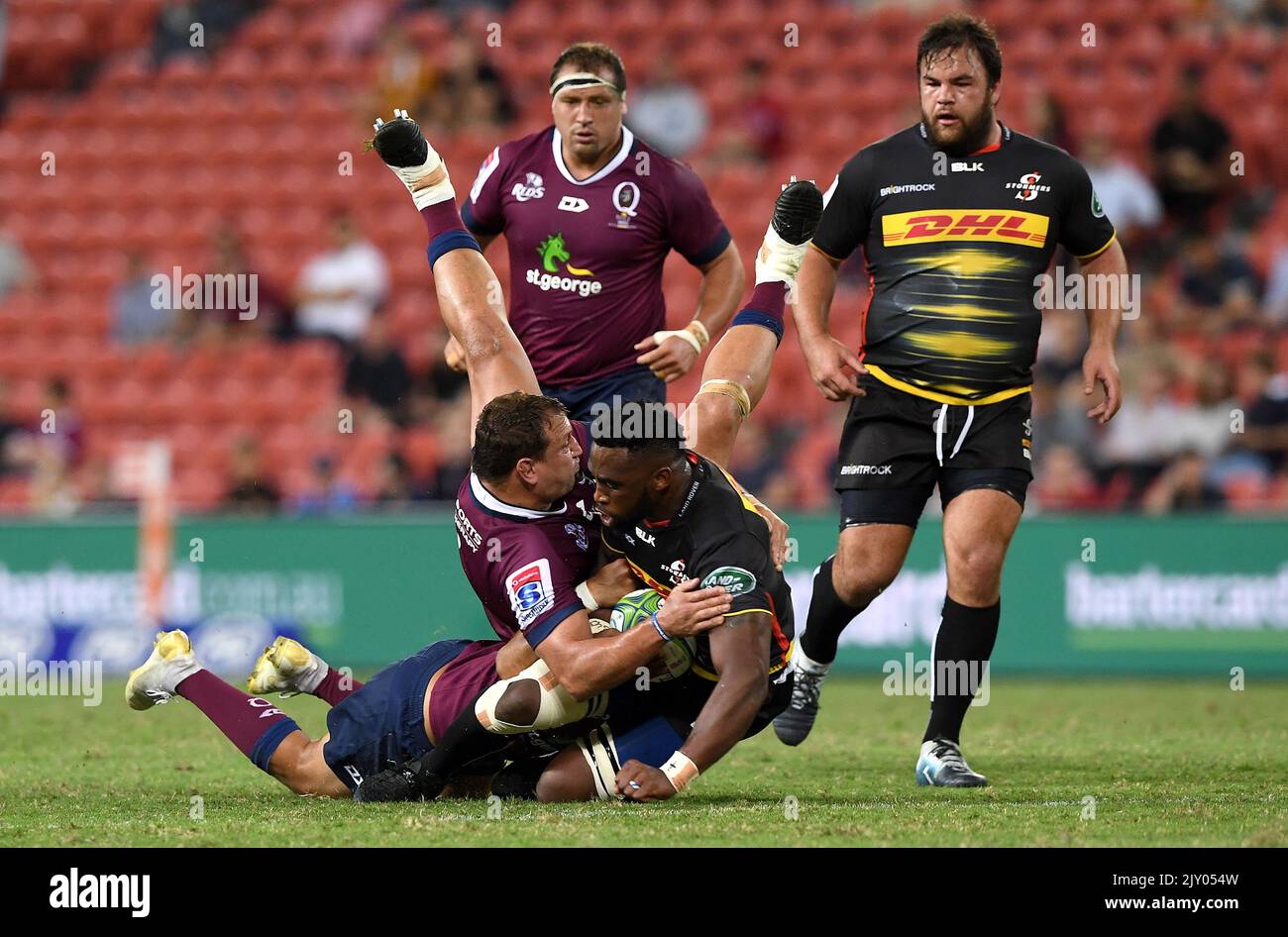 Jean-Pierre Smith of the Reds tackles Siya Kolisi of the Stormers ...