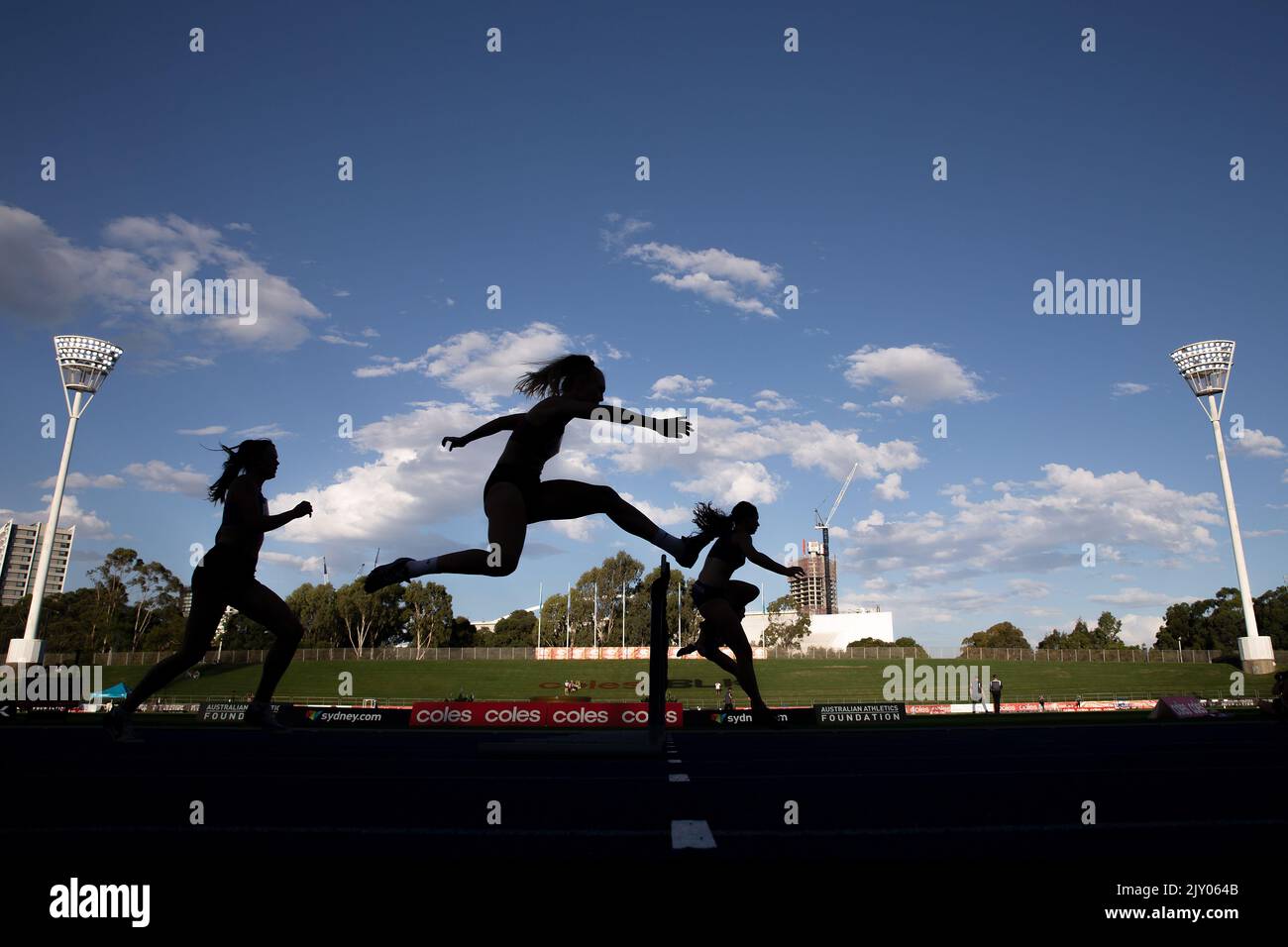 Athletes are seen during the first semi-final of the women's 400m ...