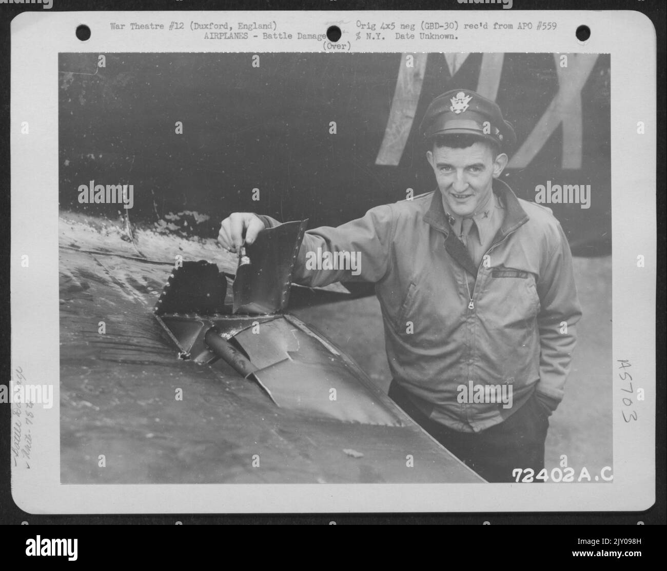 A Pilot Of The 78Th Fighter Group Inspects Battle Damaged Wing Of A ...