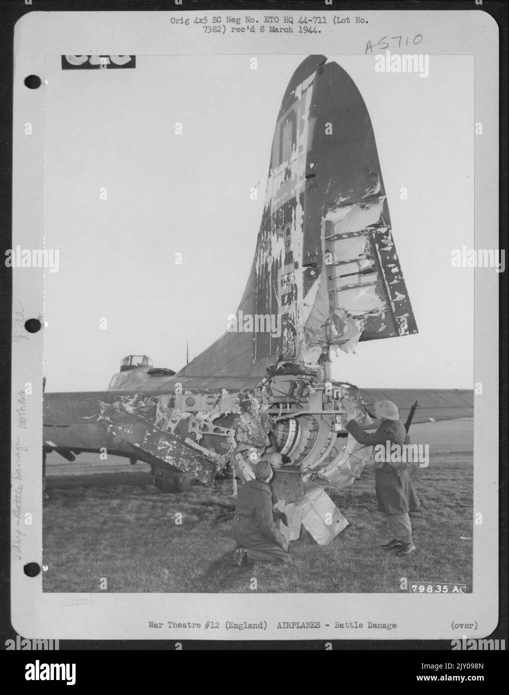Field Guards Inspect The Damaged Tail Of A Boeing B-17 Which Was Hit By ...