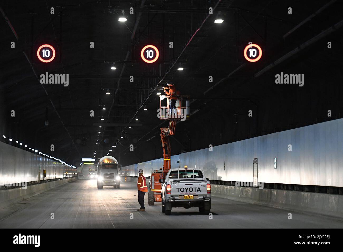 Construction workers are seen in the almost-completed M4 WestConnex ...