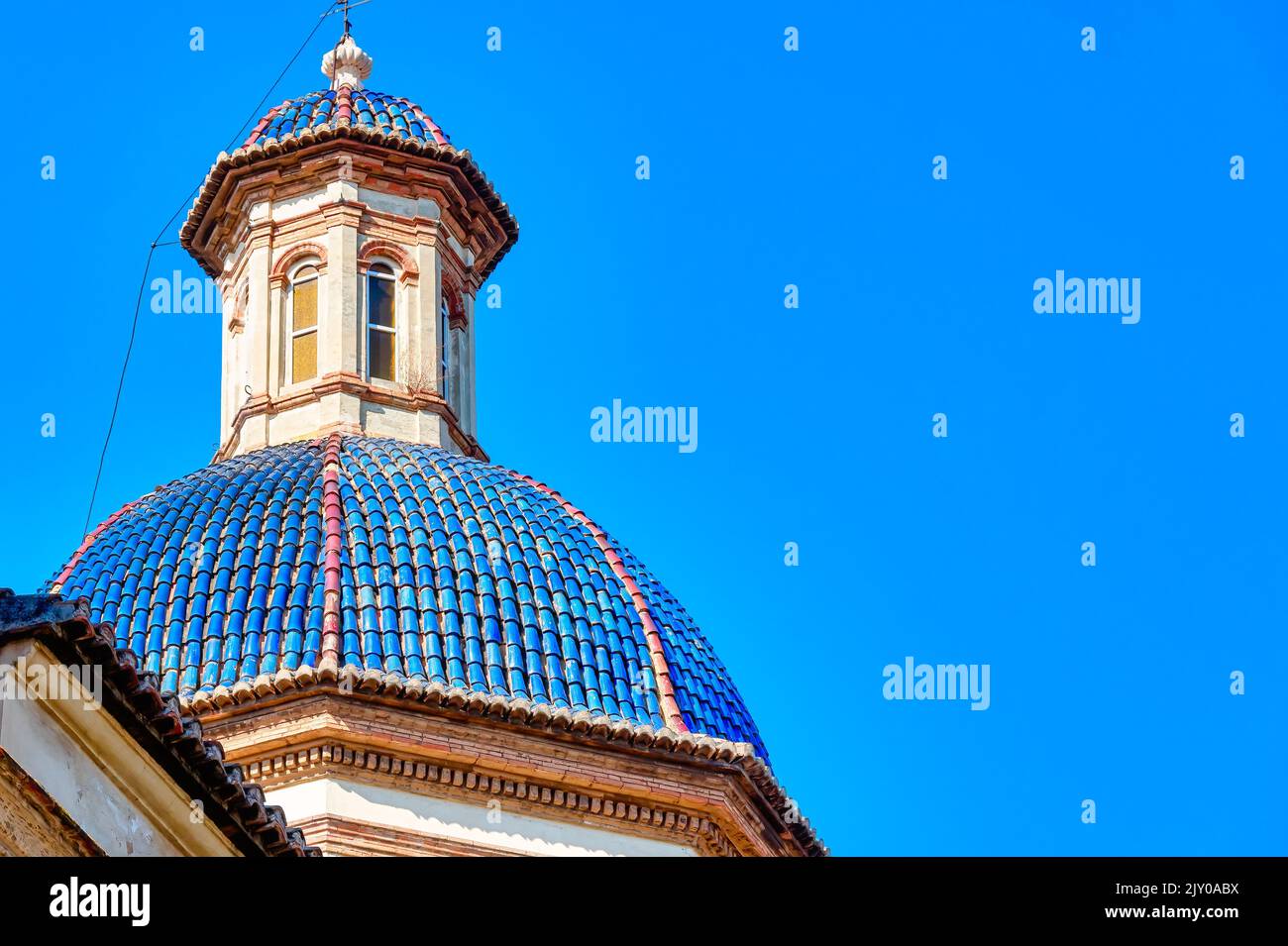 Old Catholic colonial church of San Sebastian y San Miguel. Blue tiles ...
