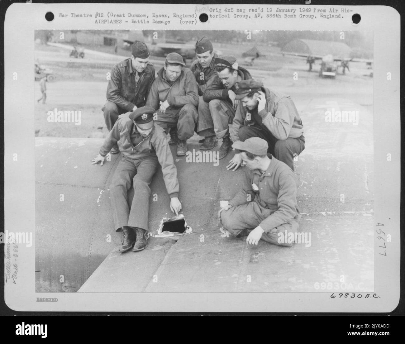 Crew Members Of The 386Th Bomb Group Inspect Damage Done To Their Plane ...
