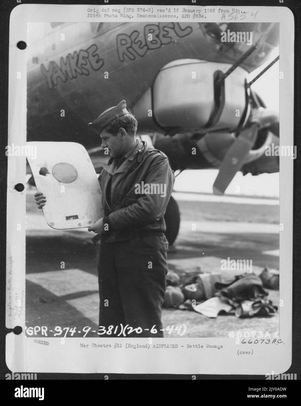 Airman Holding A Damaged Plate By Boeing B-17 "Flying Fortress" 'Yankee ...