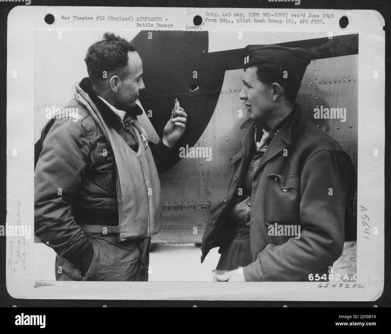 As Capt. Wood Looks On, Colonel Harold W. Bowman Examines A Piece Of ...