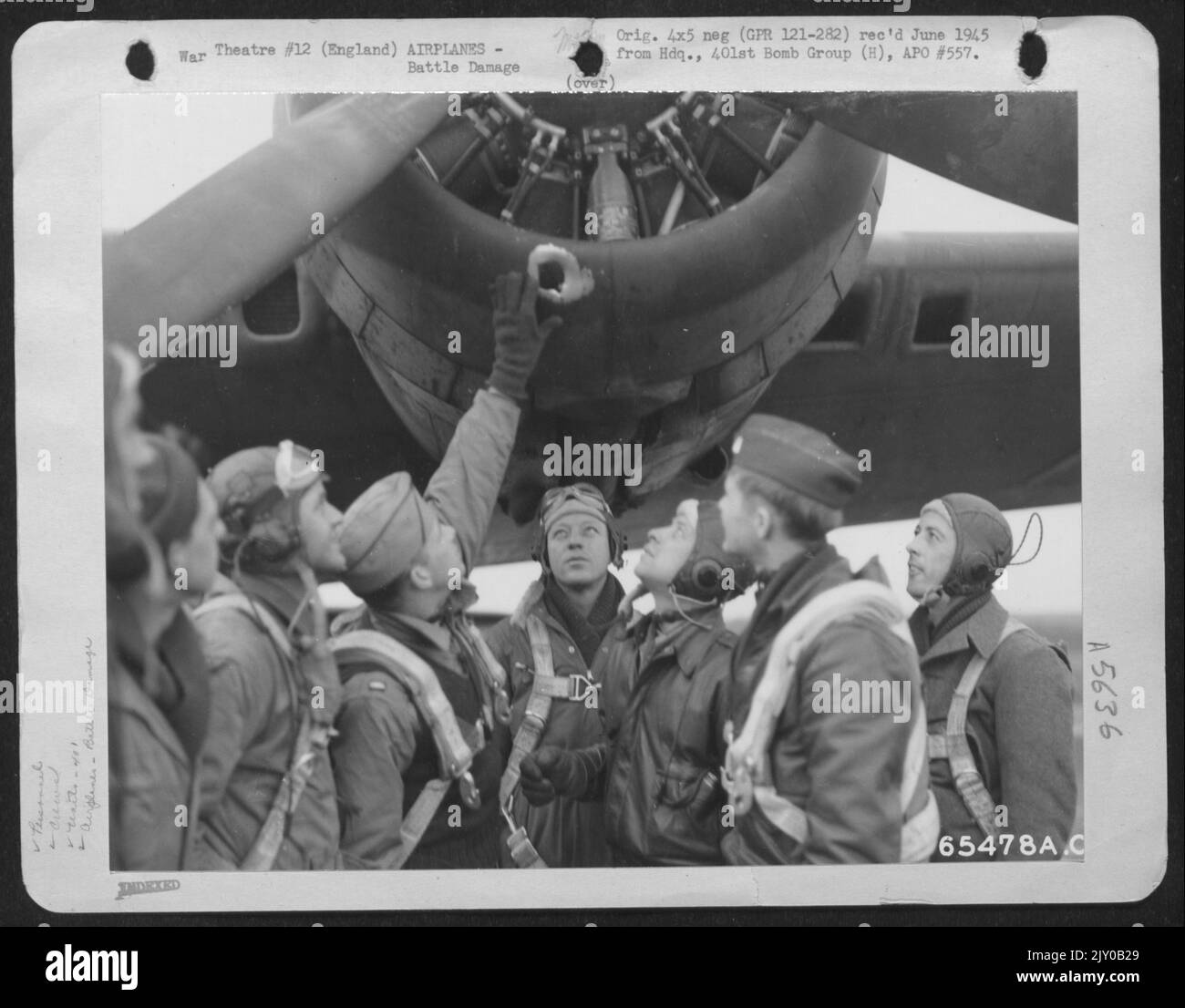 Lt. Schotts And Crew Of The 401St Bomb Group Examine Shell Hole In ...