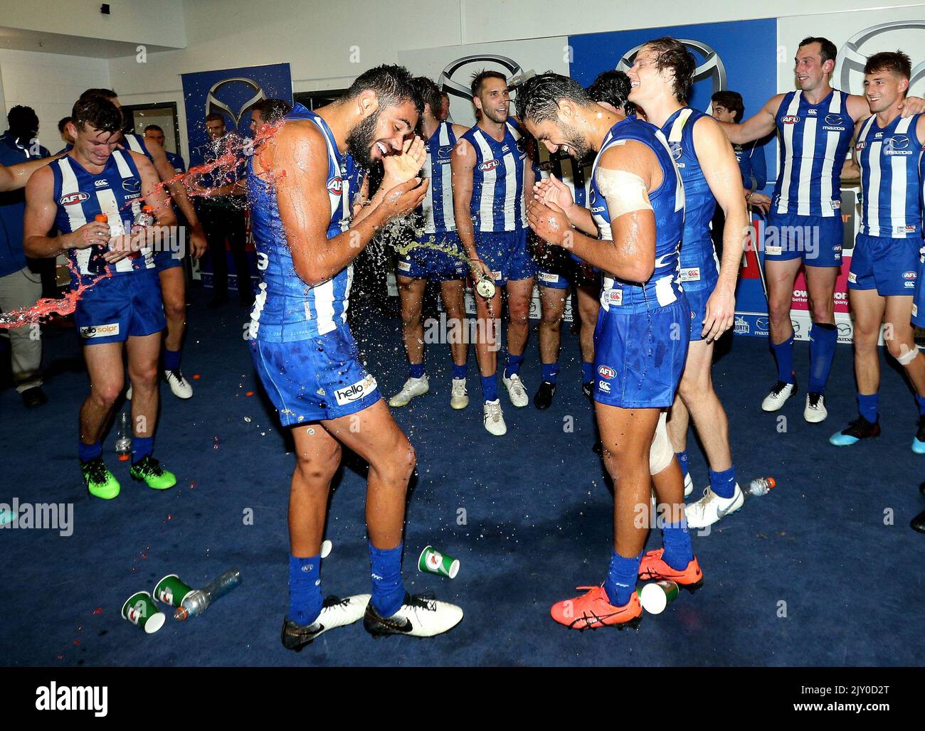 Tarryn Thomas (left) and Aaron Hall of the Kangaroos celebrate their ...