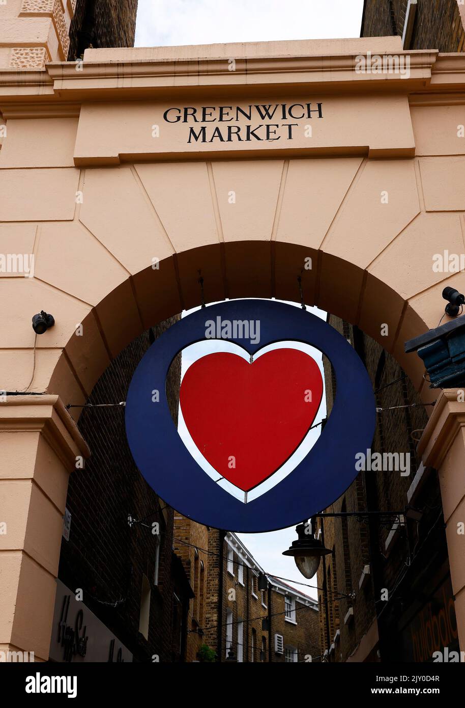 An entrance to Greenwich Market in London UK with the sign and a logo ...
