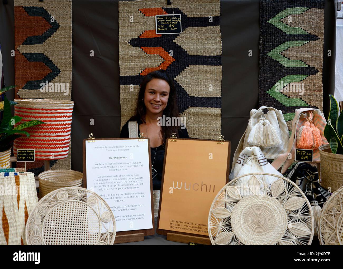 Trader seen posing on Greenwich indoor market in London, UK with a ...