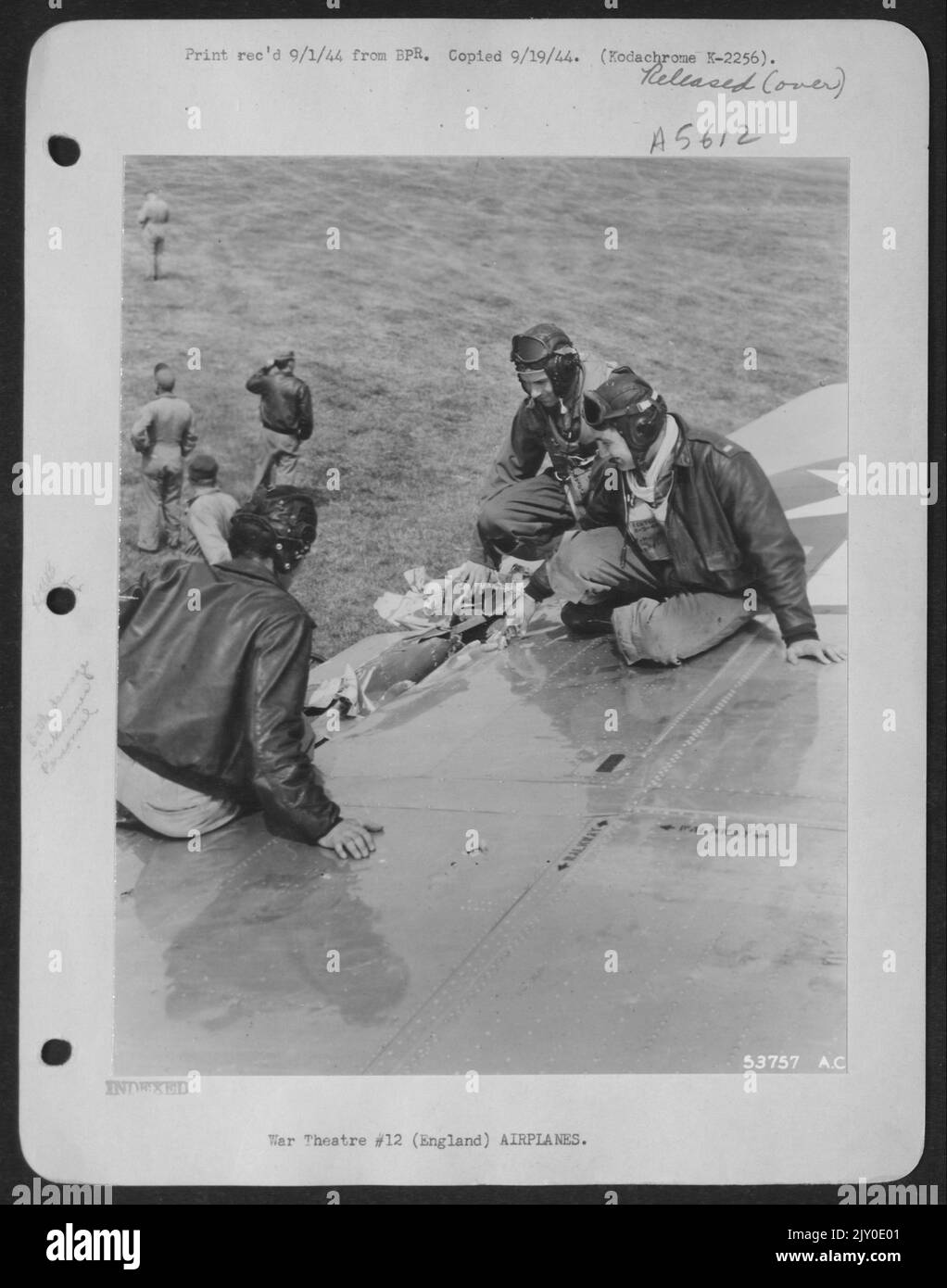 ENGLAND-Examining trailing edge of left wing after a 20 mm. cannon ...