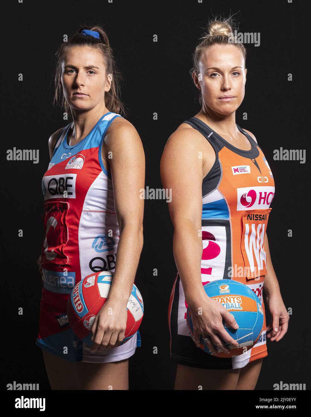 Maddy Proud of the Swifts (left) and Kim Green of the Giants pose for a ...
