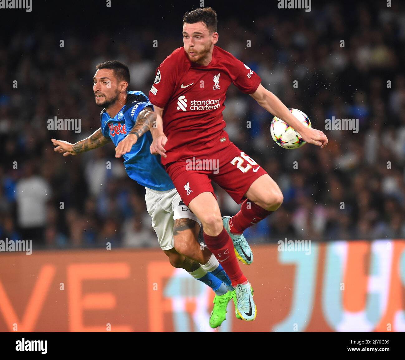 Napoli's Matteo Politano (left) and Liverpool's Andrew Robertson in ...