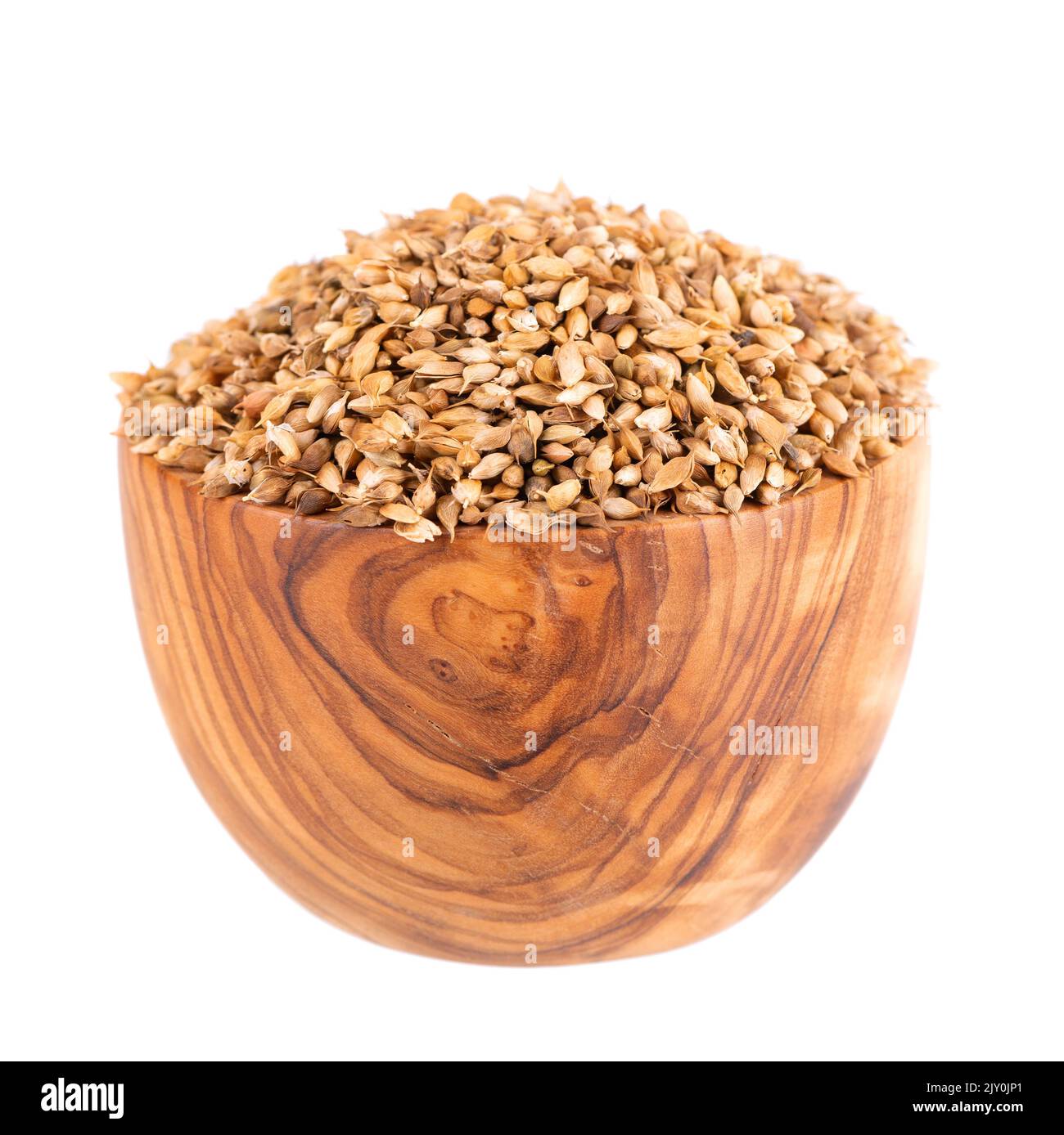 Utsho suneli seeds in wooden bowl, isolated on white background ...