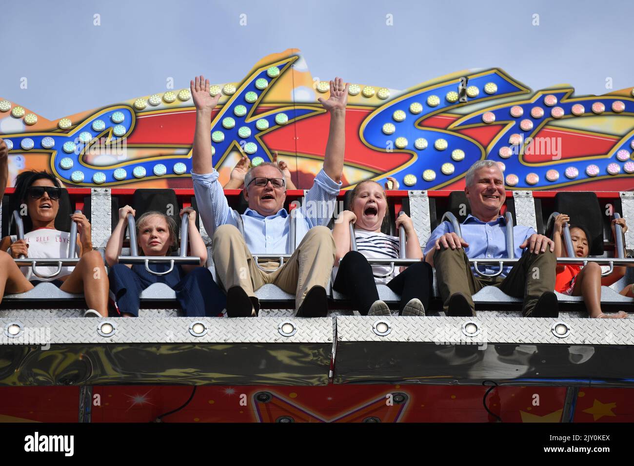 Prime Minister Scott Morrison with daughters Lily (L) and Abbey (R) and ...
