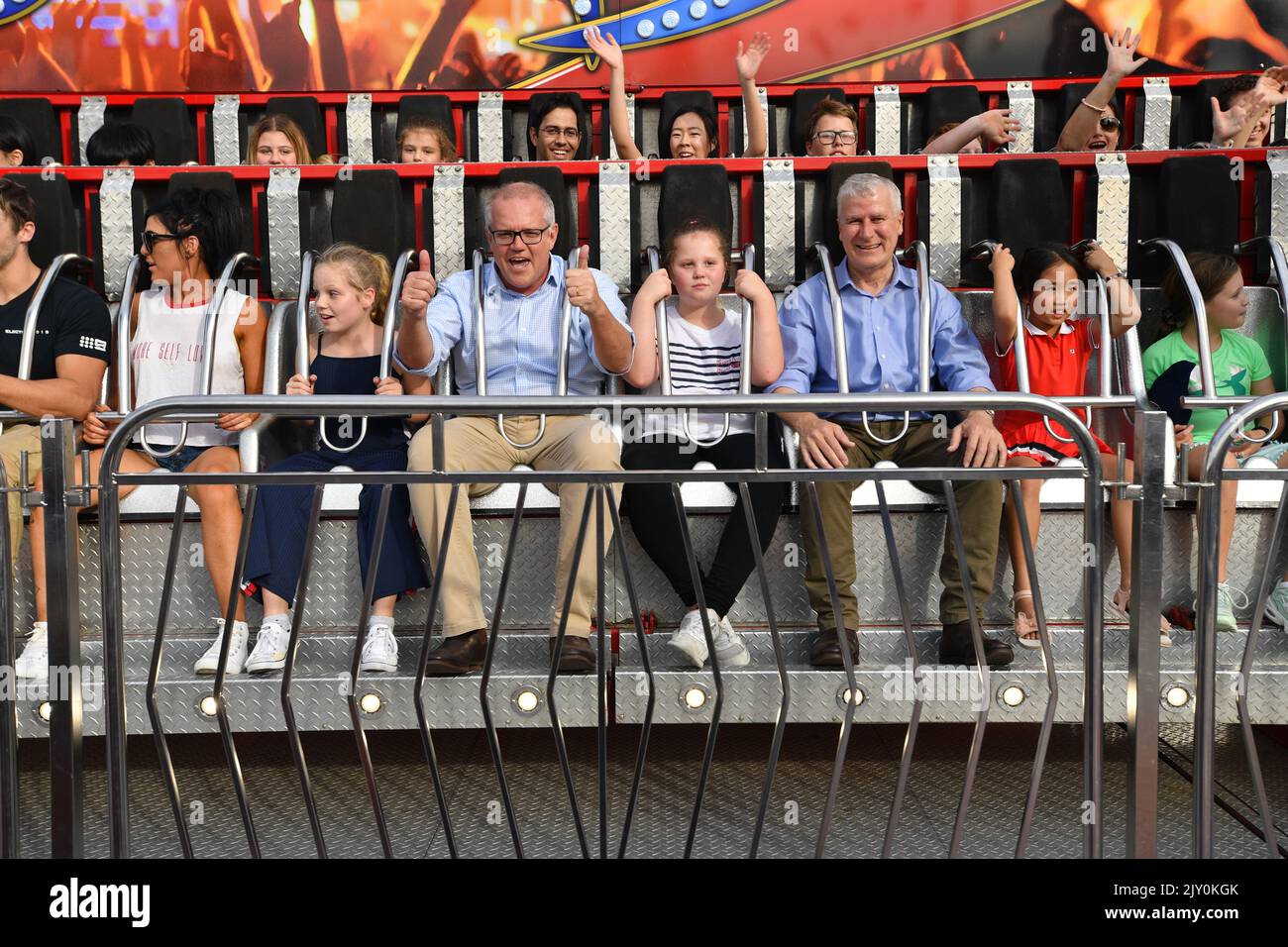 Prime Minister Scott Morrison with daughters Lily (L) and Abbey (R) and ...