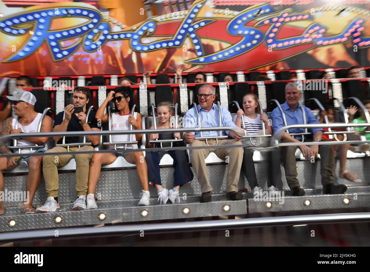 Prime Minister Scott Morrison with daughters Lily (L) and Abbey (R) and ...