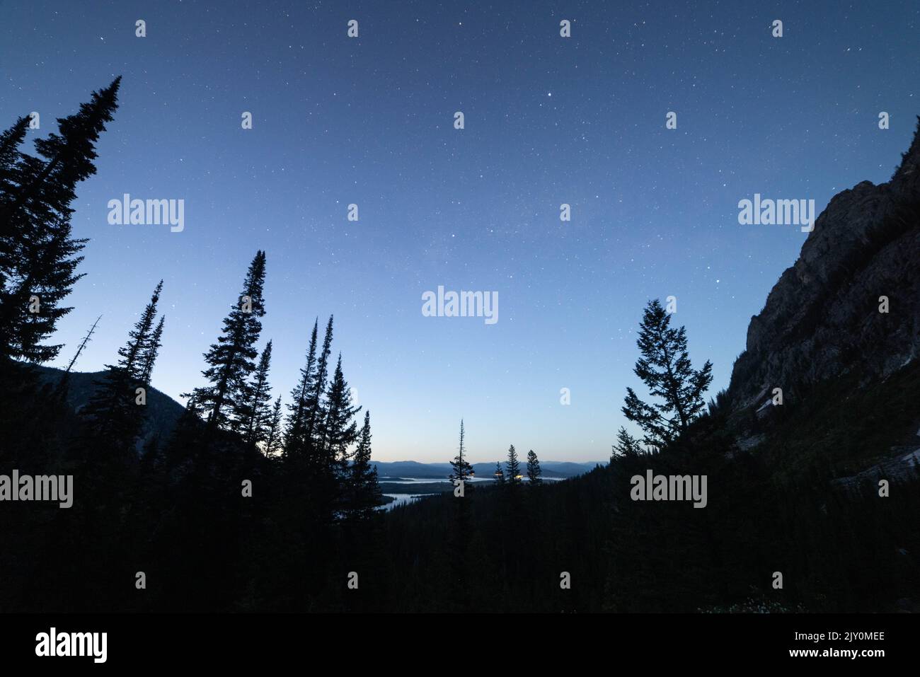 Stars beginning to emerge and fill the night sky at twilight above ...