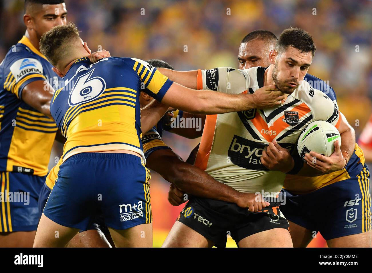 Alex Twal of the Tigers is held by the Eels defence during the Round 6 ...
