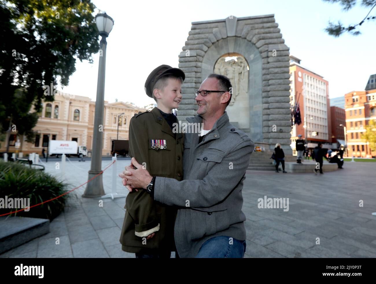 Caelan Ryan, 9, with his dad Damian Ryan, wears his great grandfathers ...