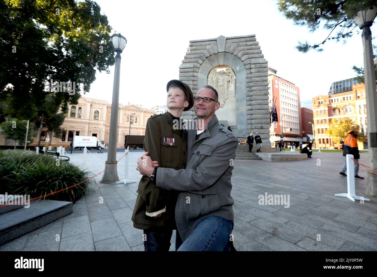 Caelan Ryan, 9, with his dad Damian Ryan, wears his great grandfathers ...