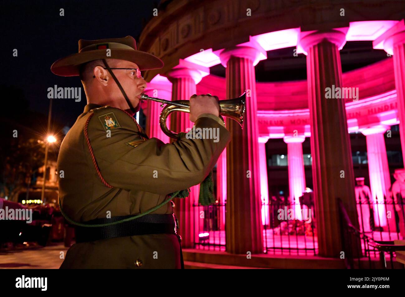 An army bugler is seen playing the last post during the Anzac Day dawn ...