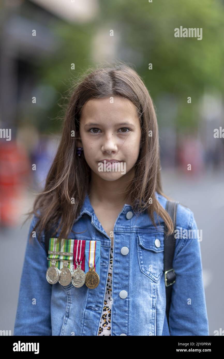 Chloe Radosevich poses with her father's war medals during the Anzac ...