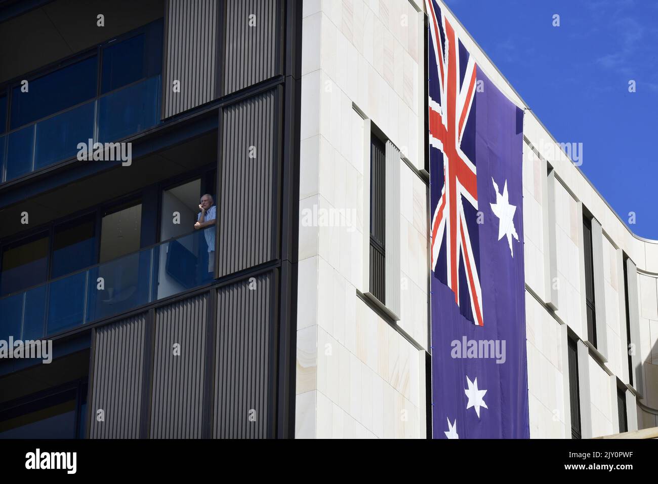 Spectators watch the 2-Up game as part of Anzac Day celebrations at ...