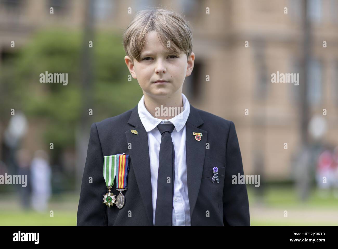 Brayden Carlson poses for a portrait with his grandfather Raymond ...