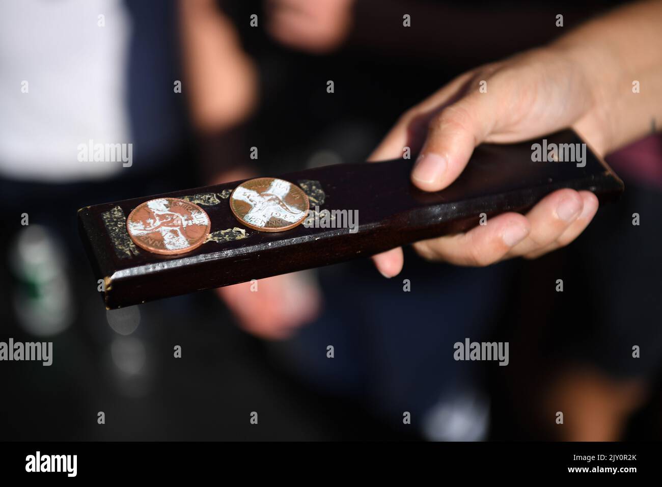 Patrons take part in a traditional game of Two-Up on Anzac Day, at the ...