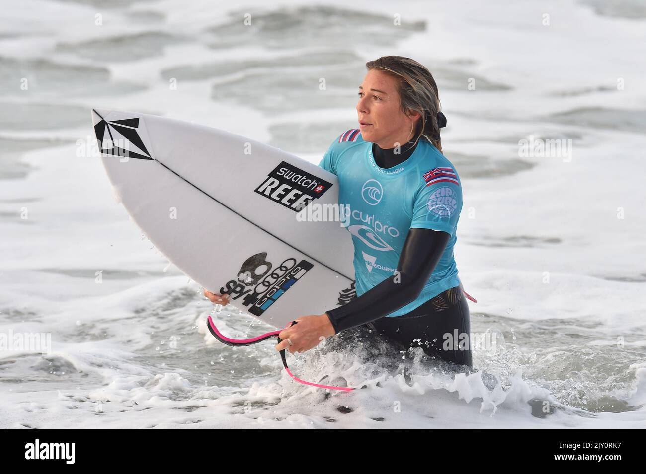 Surfer Coco Ho exits the water after heat one of the quarter finals ...