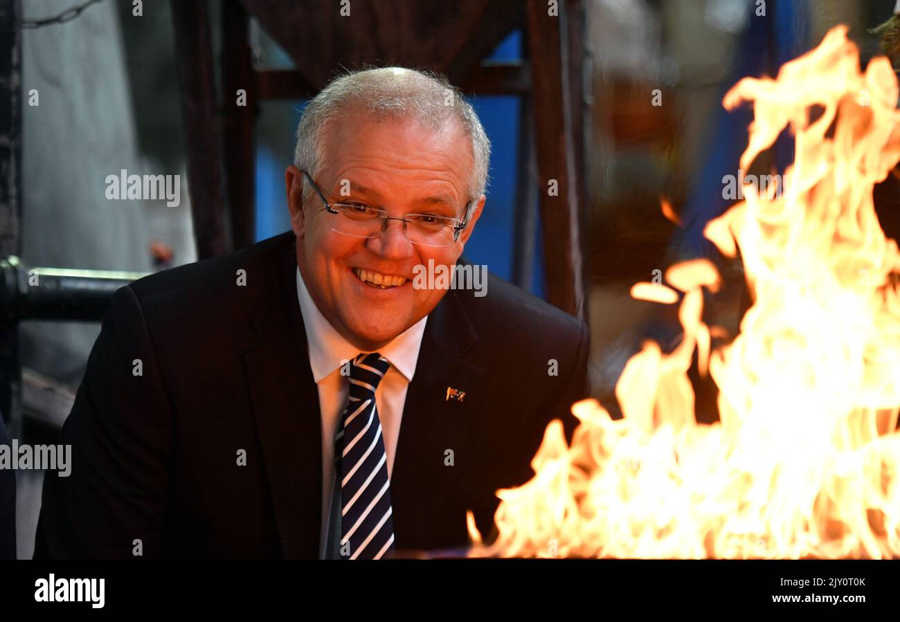 Prime Minister Scott Morrison watches burn roller at a visit to ...