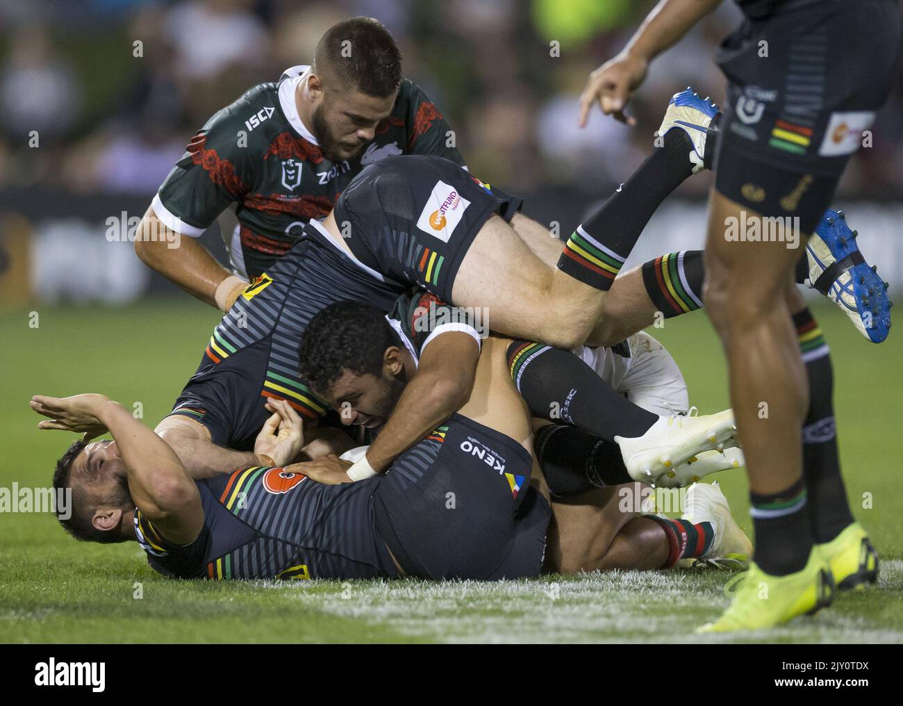 Alexander Johnston of the Rabbitohs is tackled during the Round 7 NRL ...